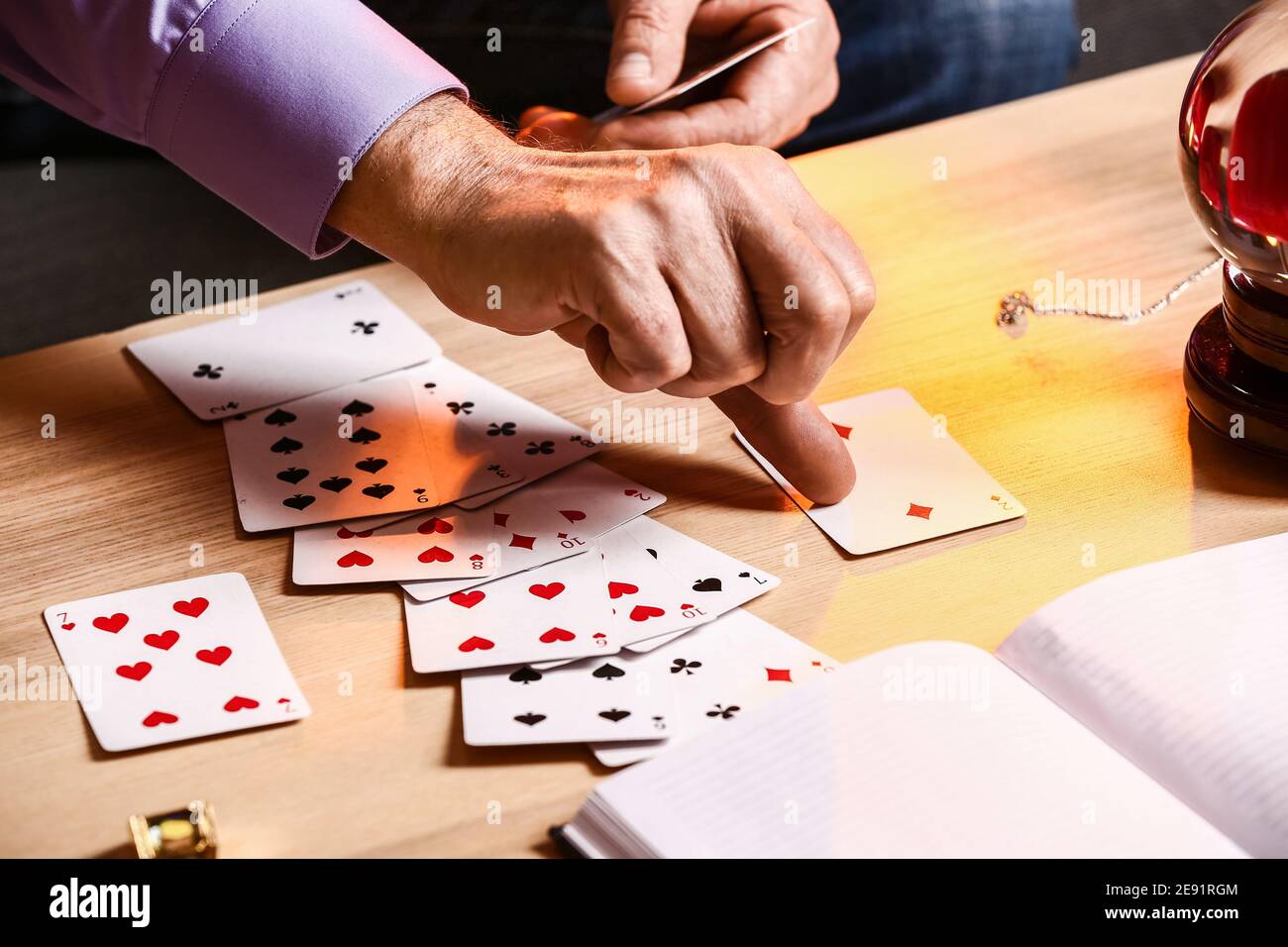 Male fortune teller with cards reading future at table, closeup Stock ...
