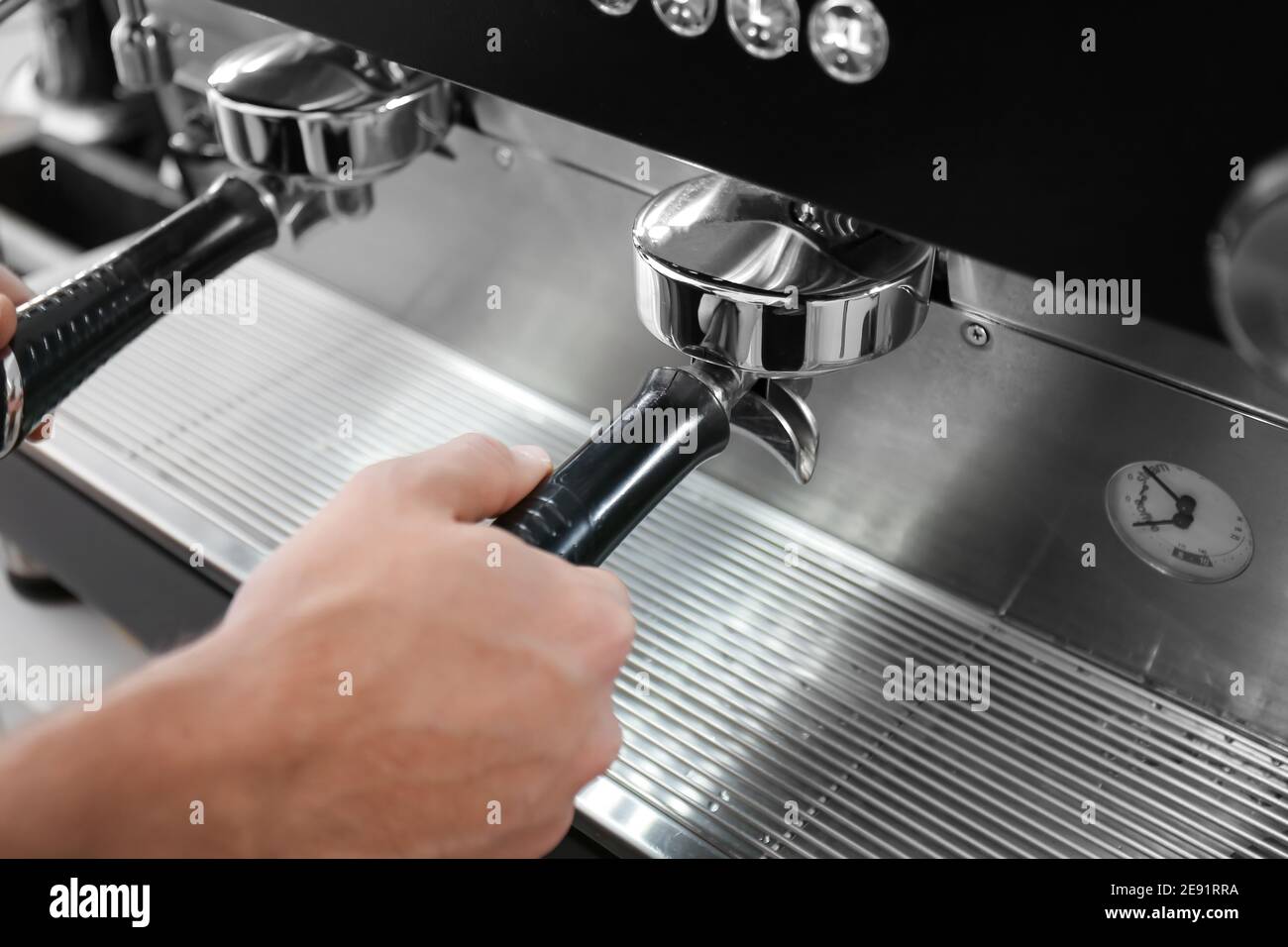 Barista making hot coffee in cafe, closeup Stock Photo - Alamy