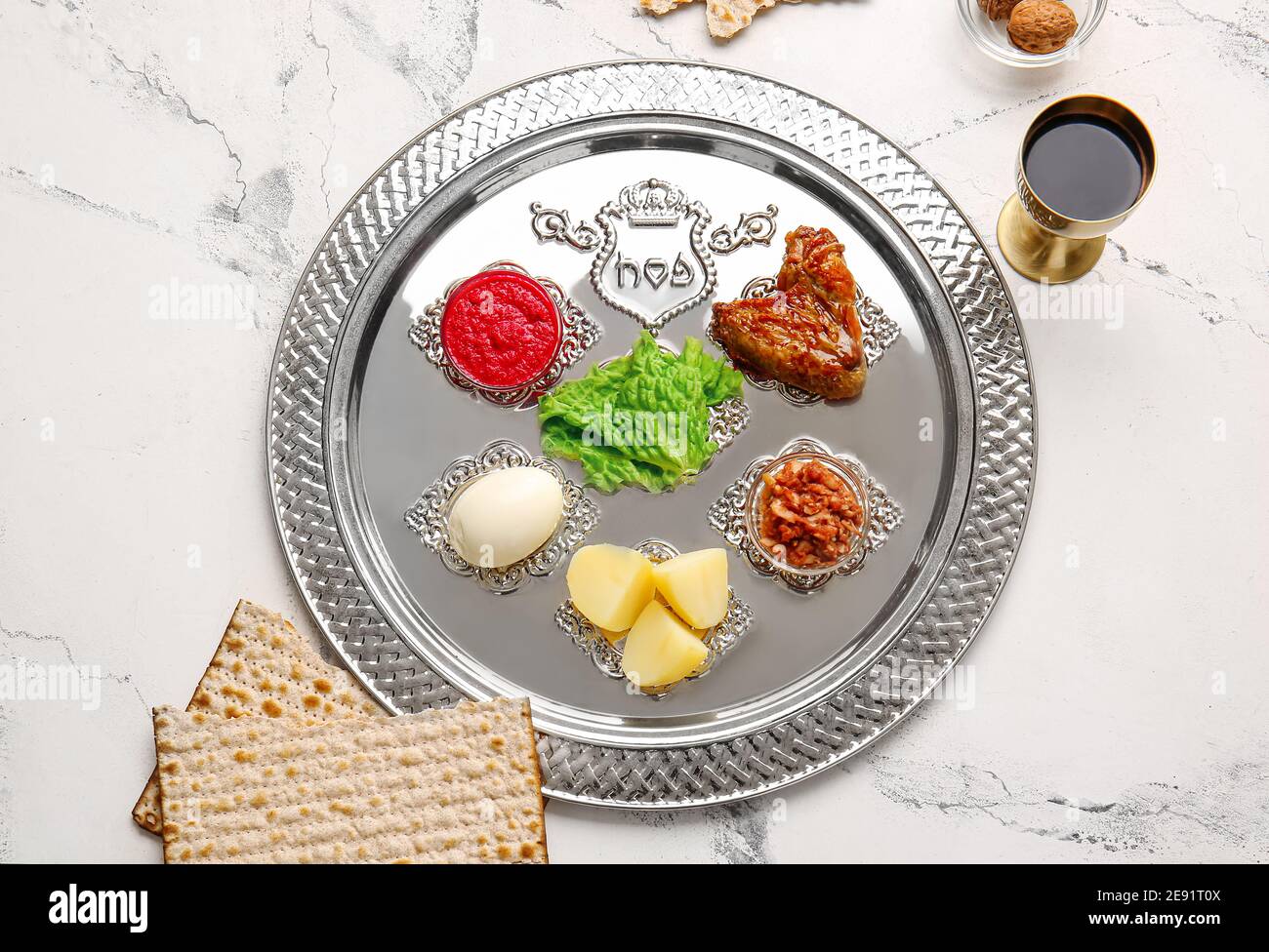 Passover Seder plate with traditional food on white background Stock ...