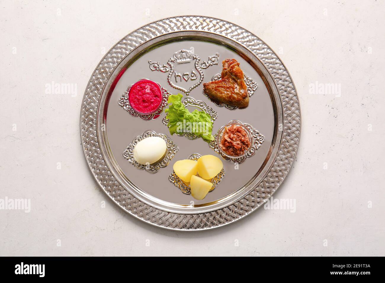 Passover Seder plate with traditional food on white background Stock ...