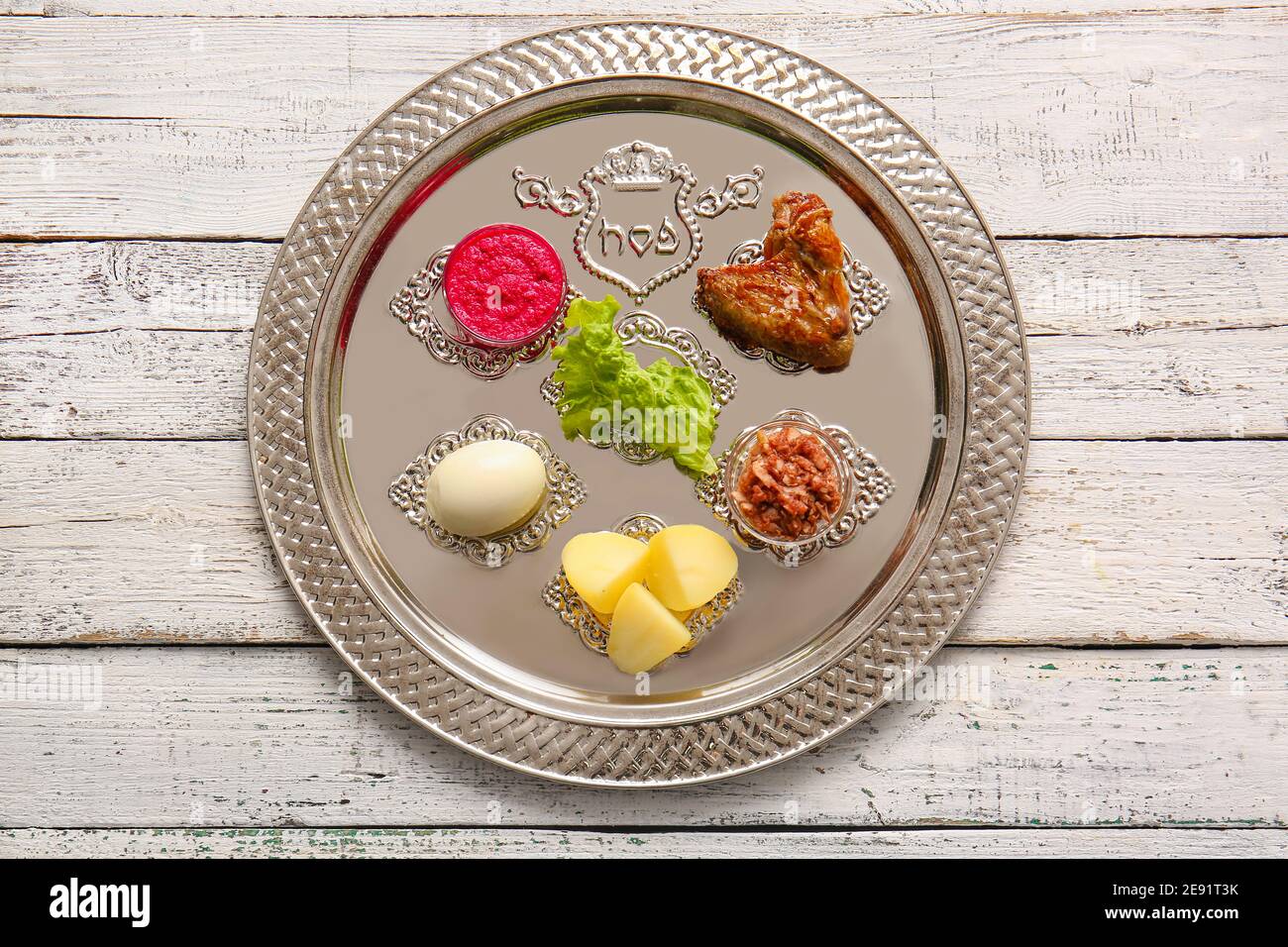 Passover Seder plate with traditional food on table Stock Photo - Alamy