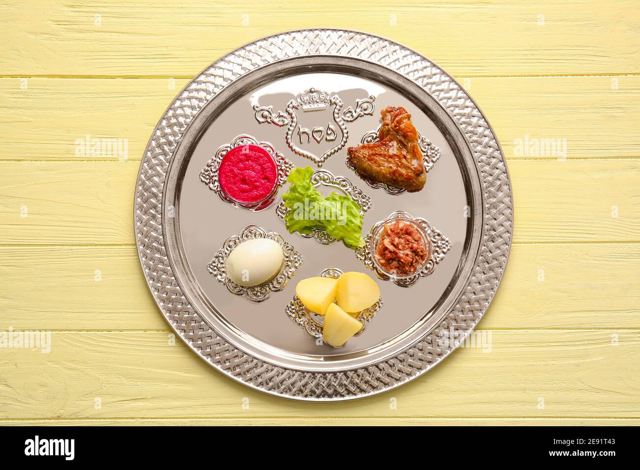 Passover Seder plate with traditional food on table Stock Photo - Alamy