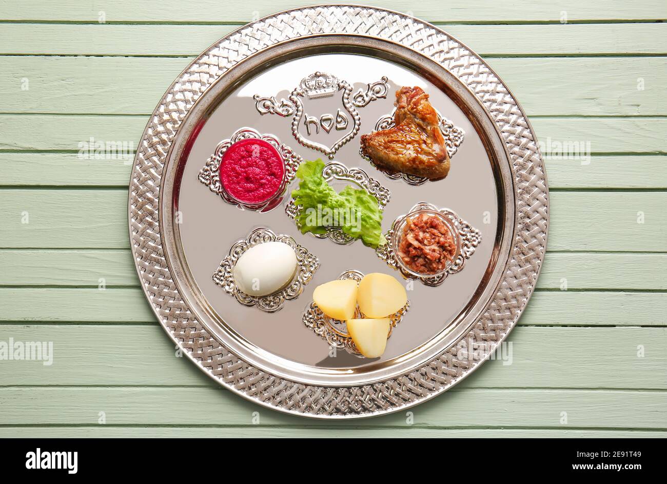 Passover Seder plate with traditional food on table Stock Photo - Alamy