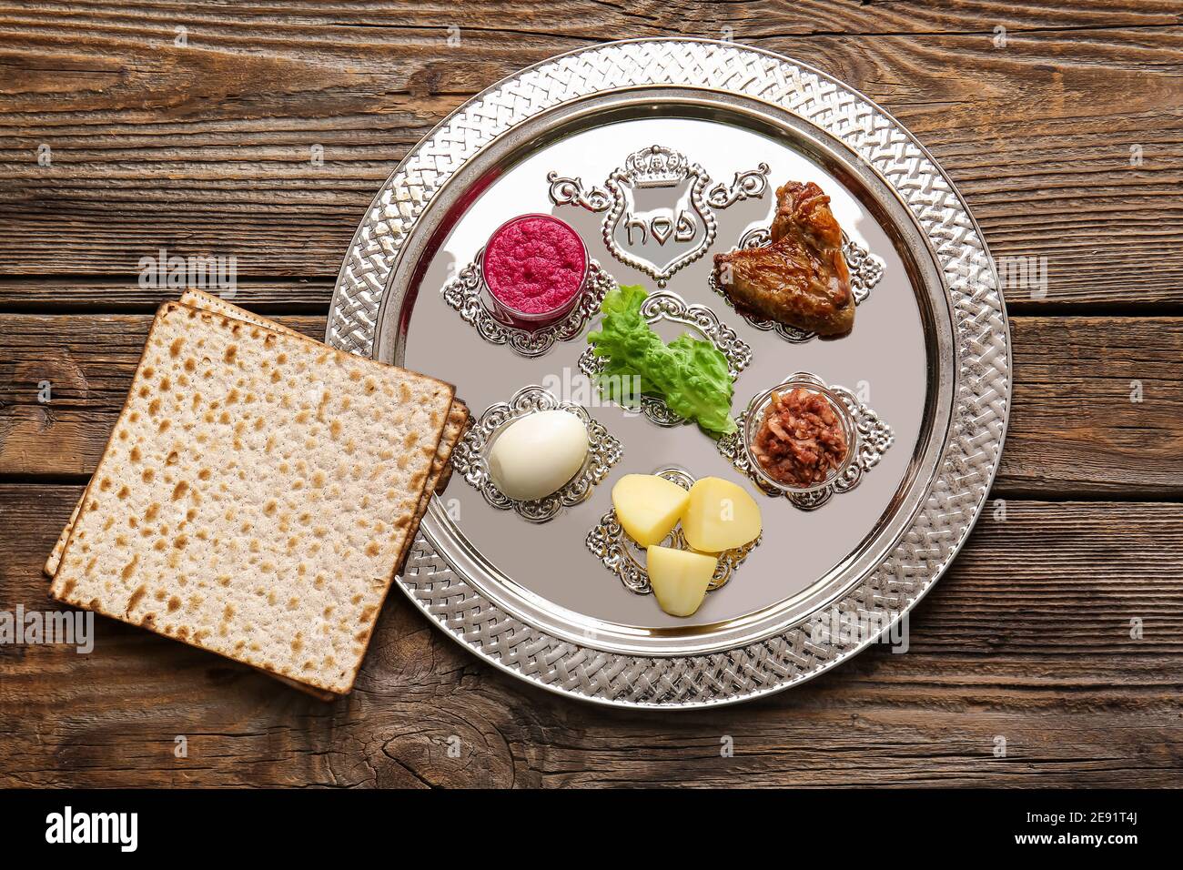 Passover Seder plate with traditional food on table Stock Photo - Alamy
