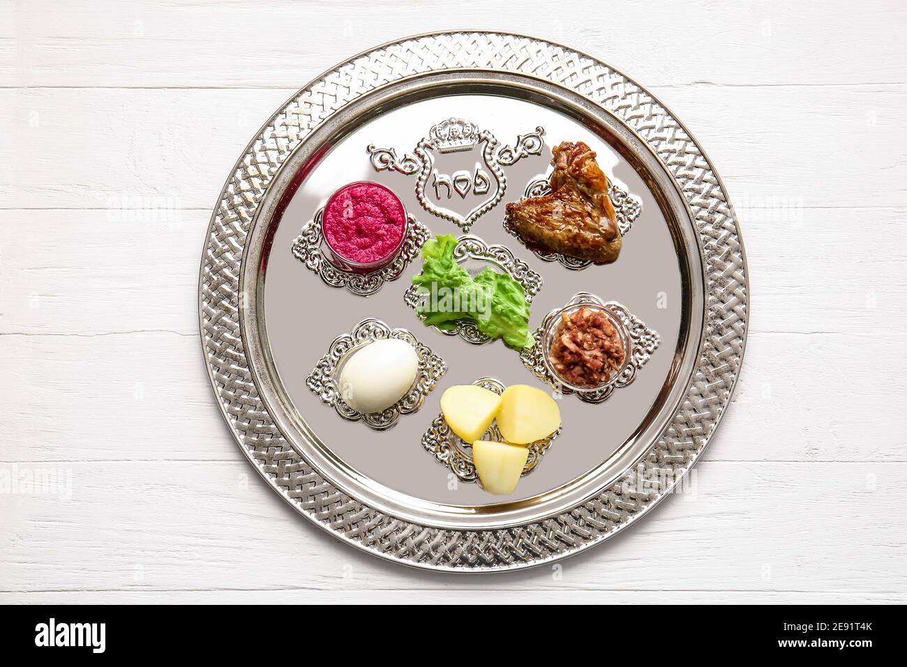 Passover Seder plate with traditional food on table Stock Photo - Alamy