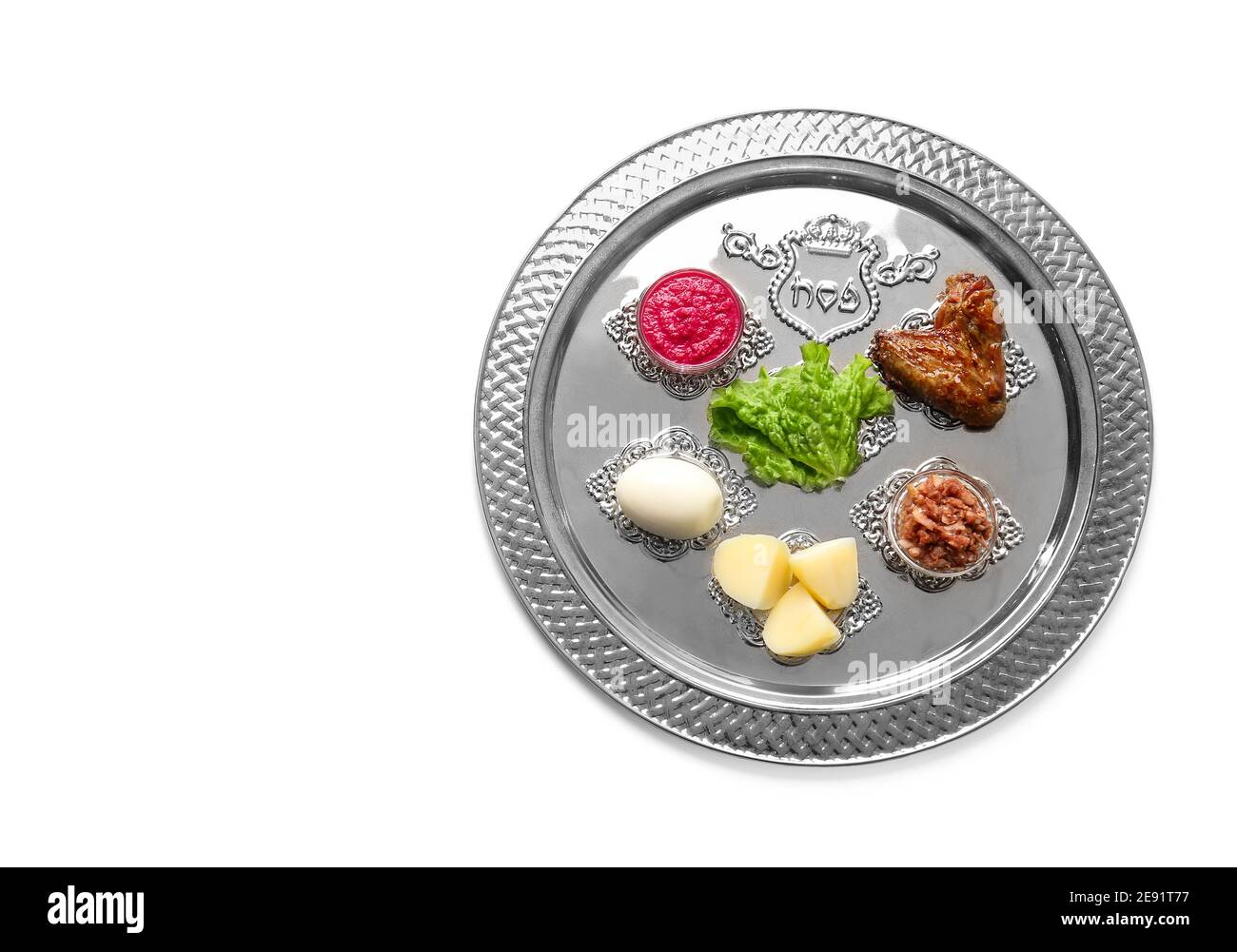 Passover Seder plate with traditional food on white background Stock ...