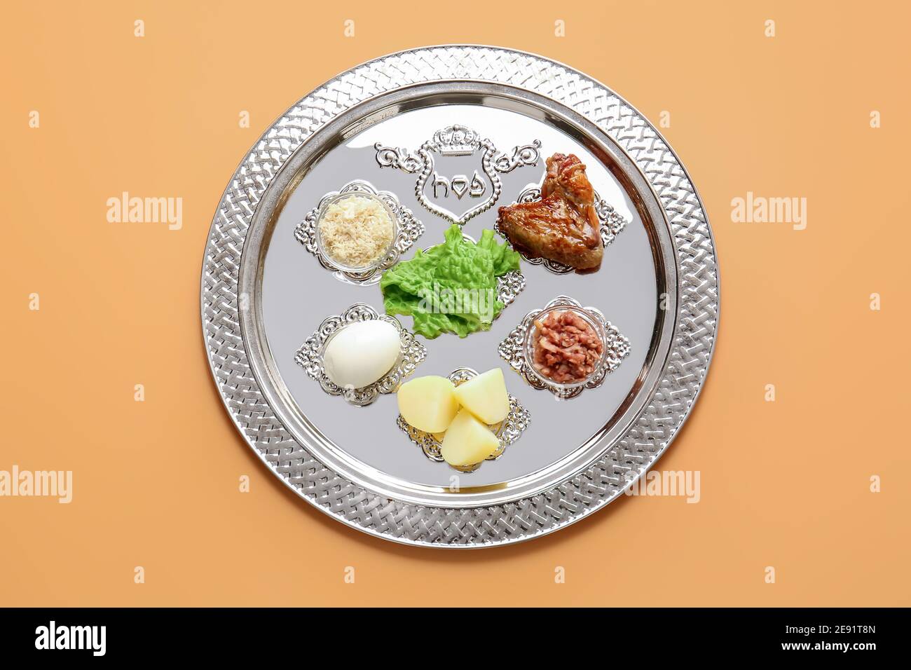 Passover Seder plate with traditional food on color background Stock ...