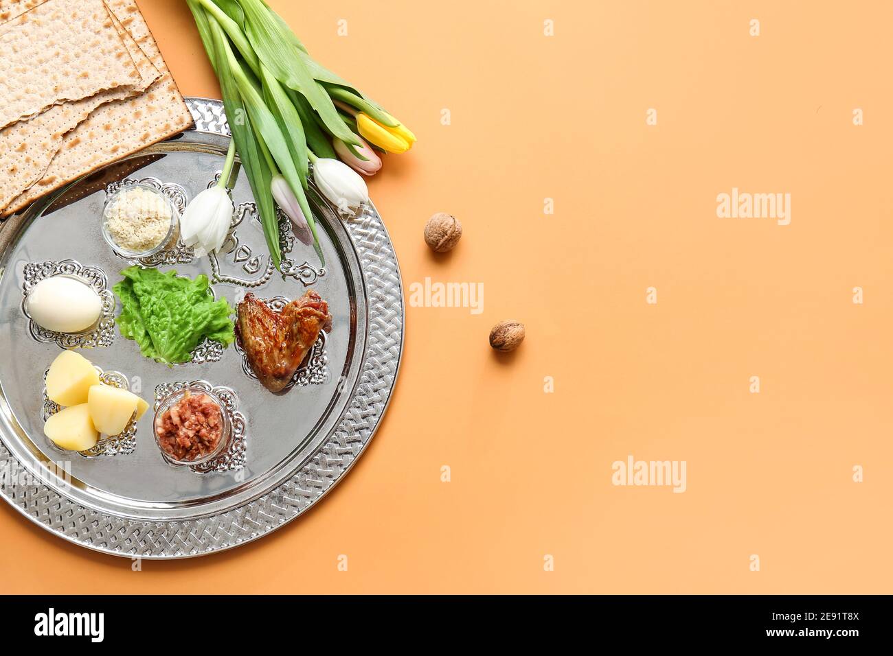 Passover Seder plate with traditional food on color background Stock ...