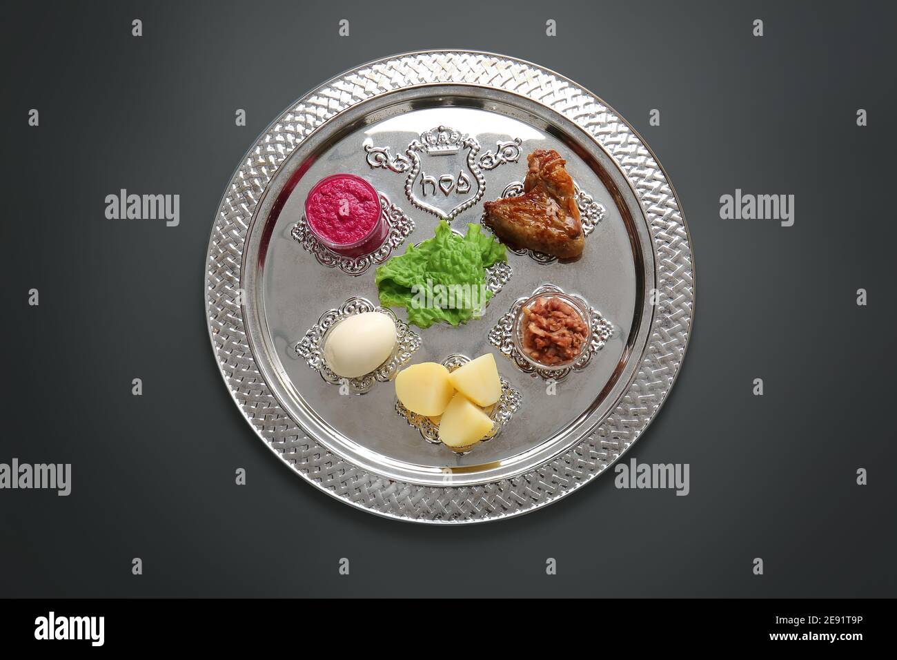 Passover Seder plate with traditional food on dark background Stock ...