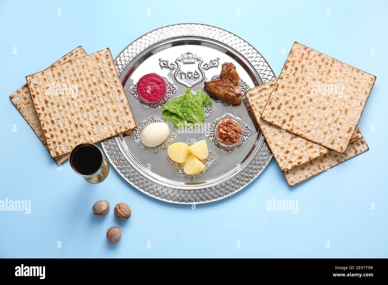 Passover Seder plate with traditional food on color background Stock ...