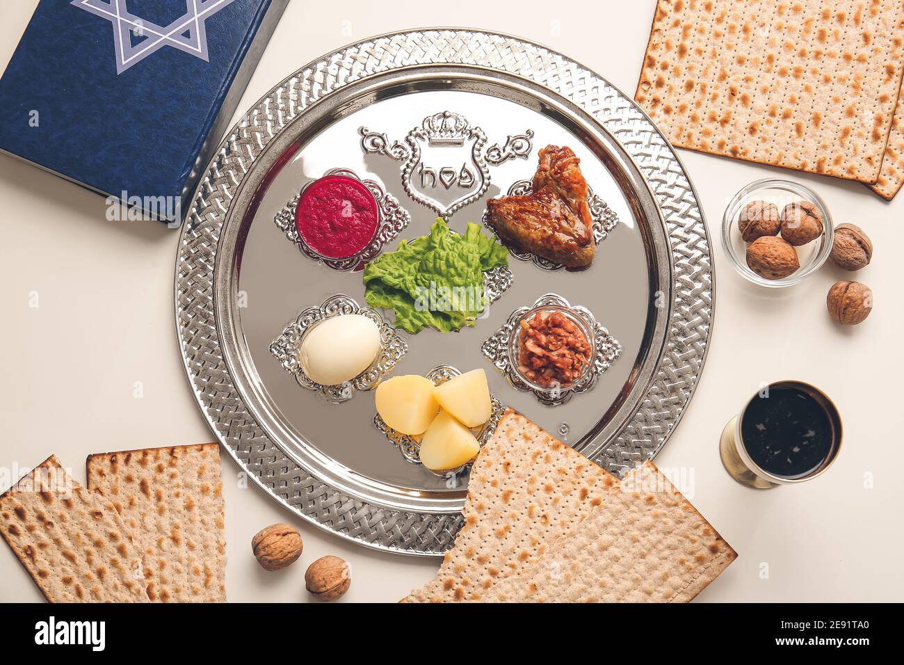 Passover Seder plate with traditional food on light background Stock ...