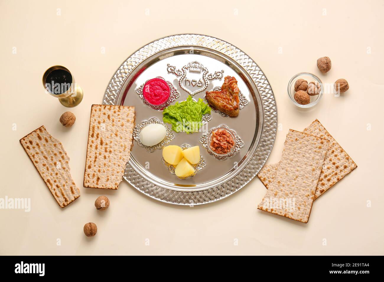 Passover Seder plate with traditional food on light background Stock ...