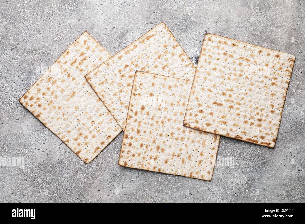Jewish flatbread matza for Passover on grey background Stock Photo - Alamy