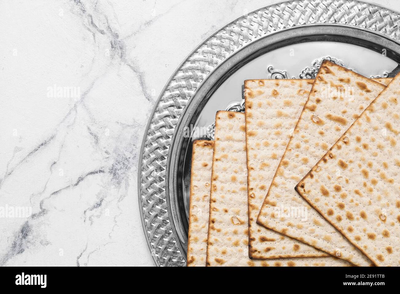 Passover Seder plate with matzo on white background Stock Photo - Alamy