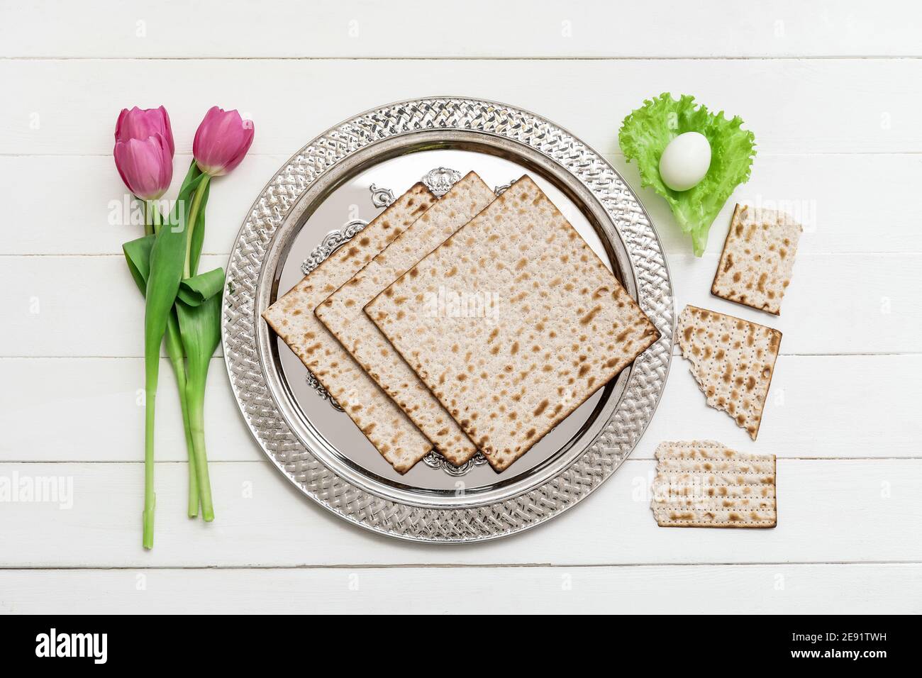 Passover Seder plate with traditional food on white wooden background ...