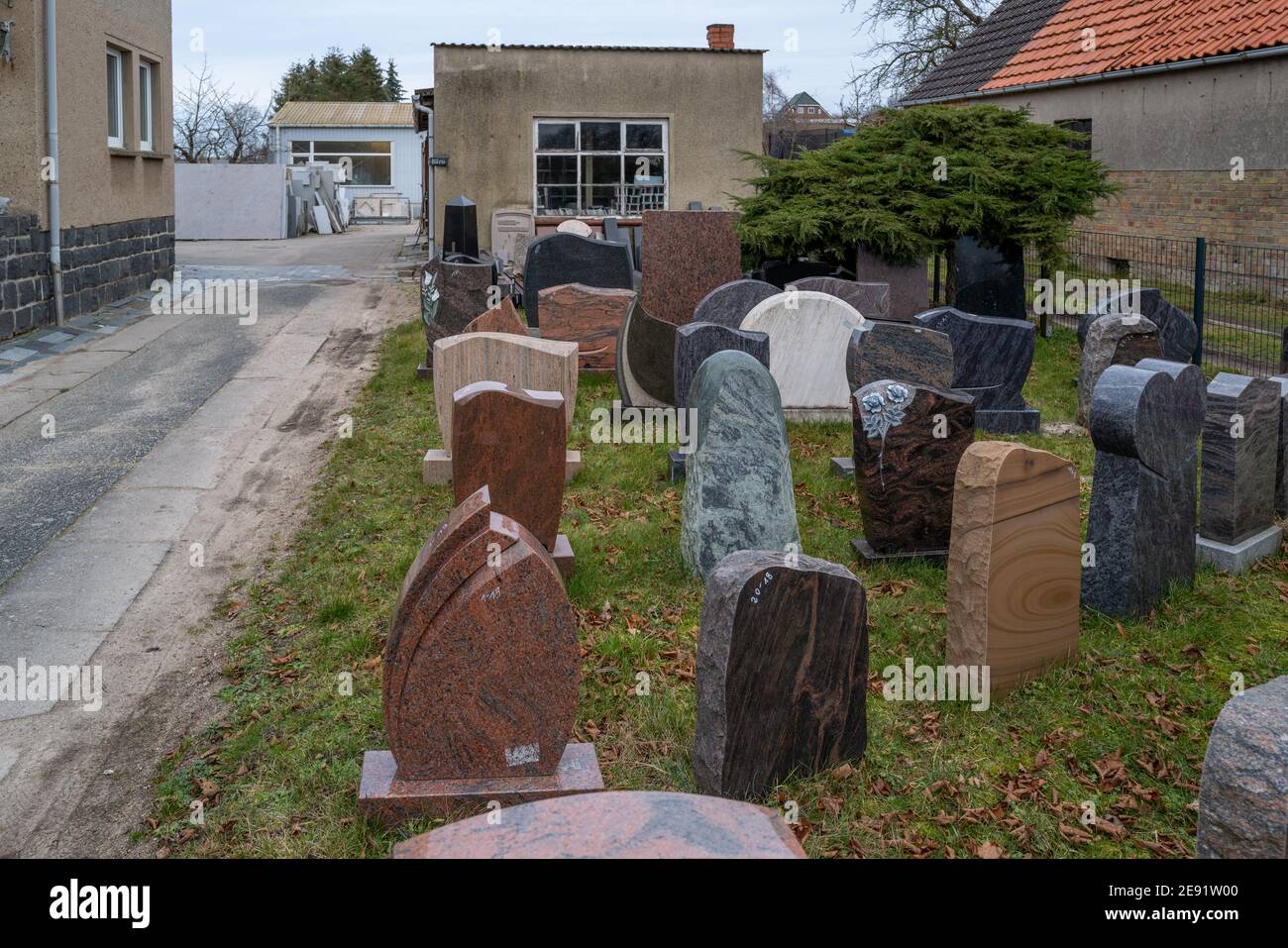 in the yard of a stonemason's workshop there are many different ...