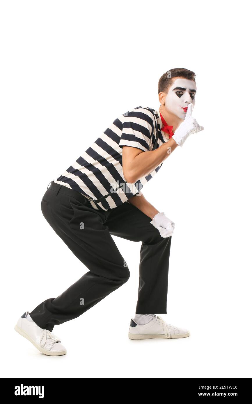 Male pantomimist showing silence gesture on white background Stock ...