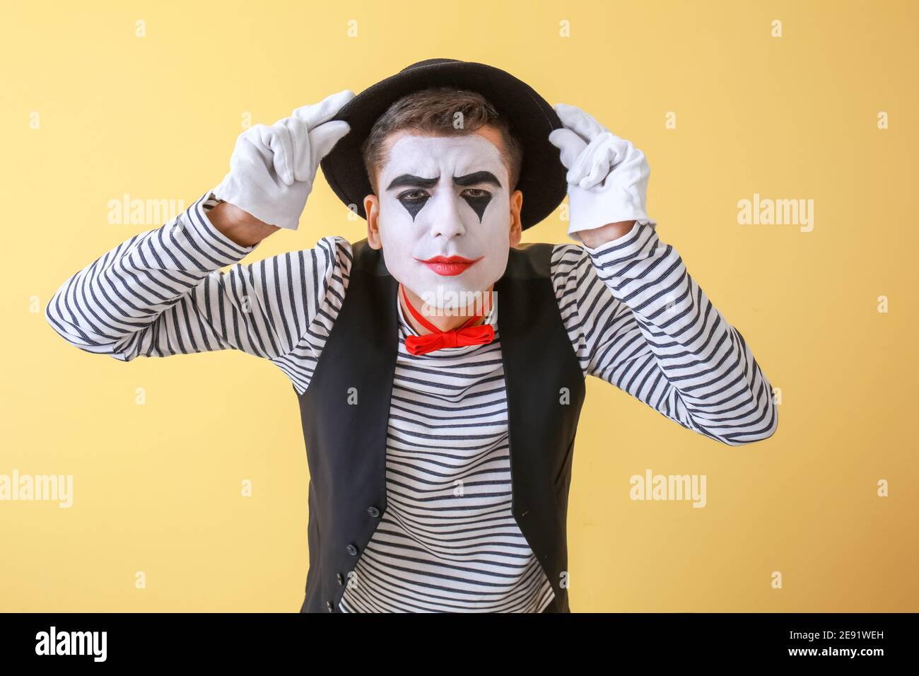 Male pantomimist on color background Stock Photo - Alamy