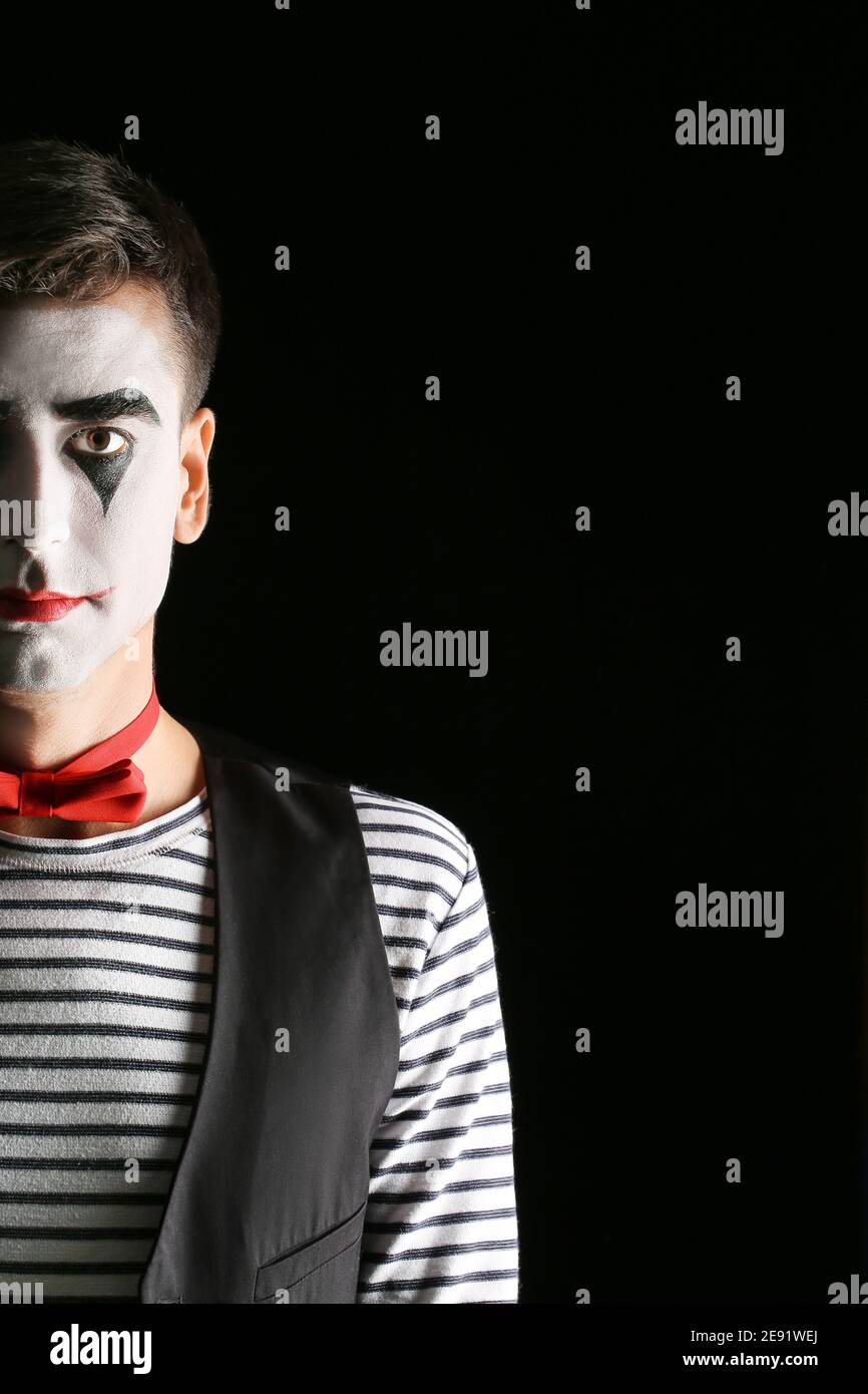 Male pantomimist on dark background Stock Photo - Alamy