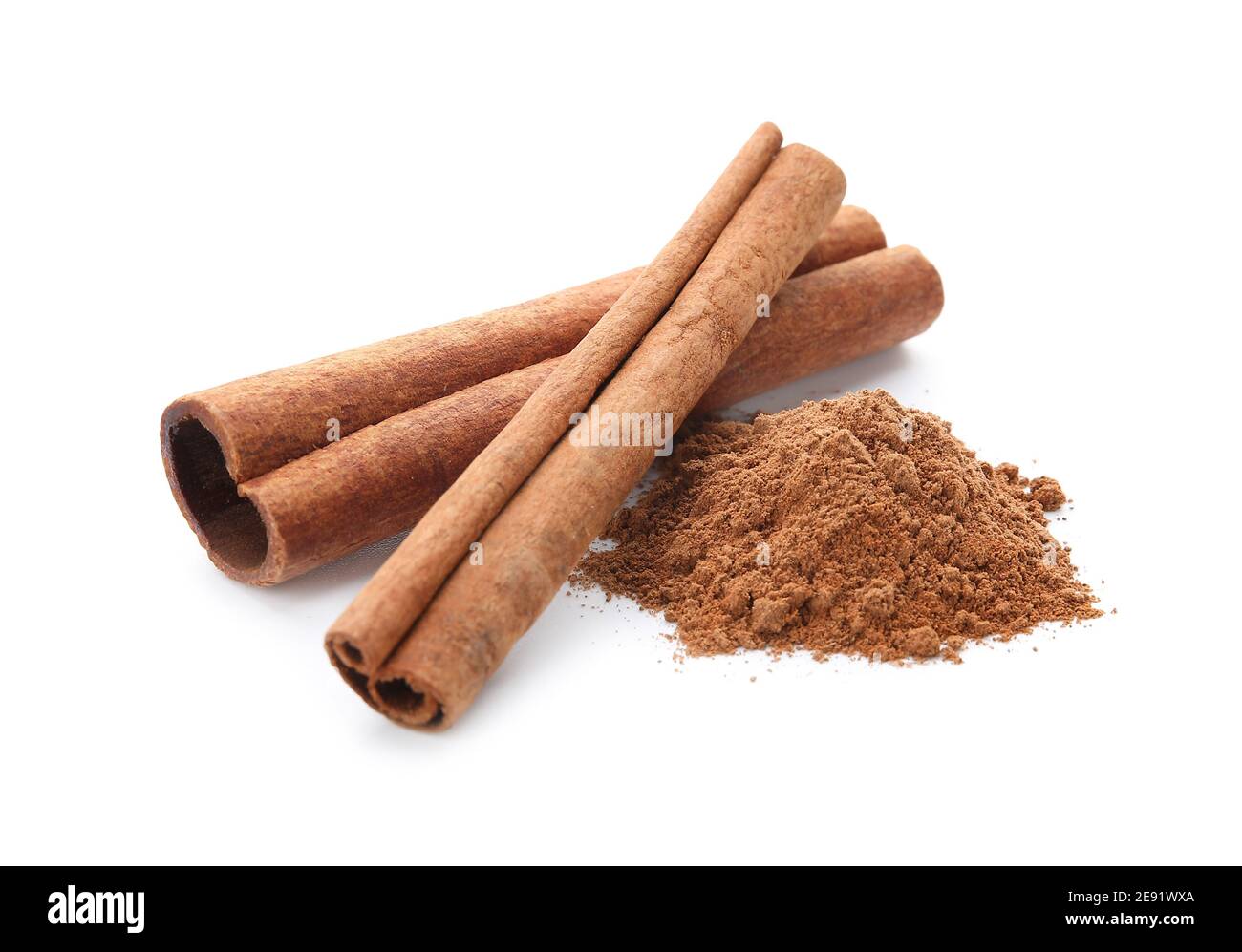 Cinnamon sticks and powder on white background Stock Photo - Alamy
