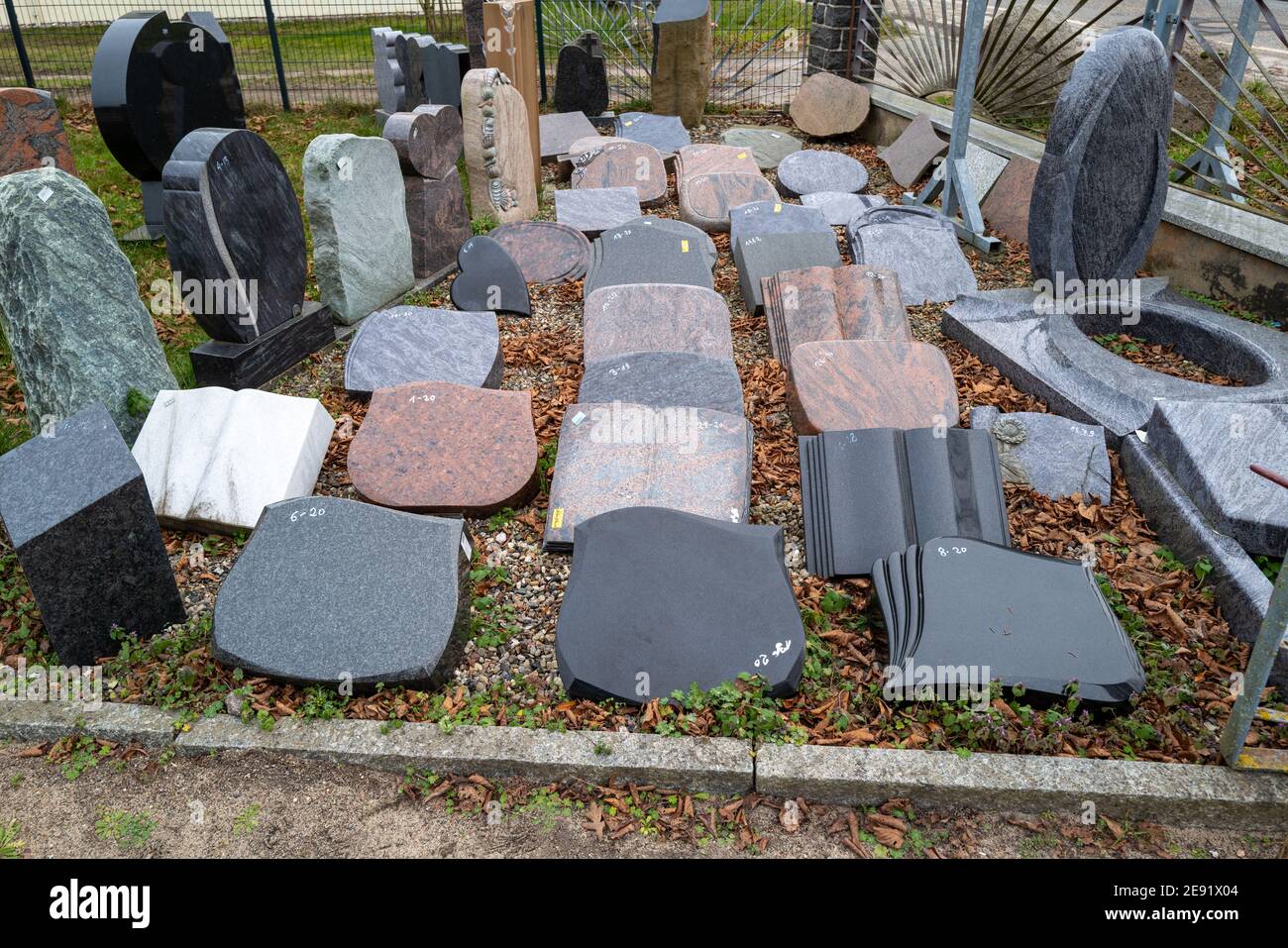 in the yard of a stonemason's workshop there are many different ...