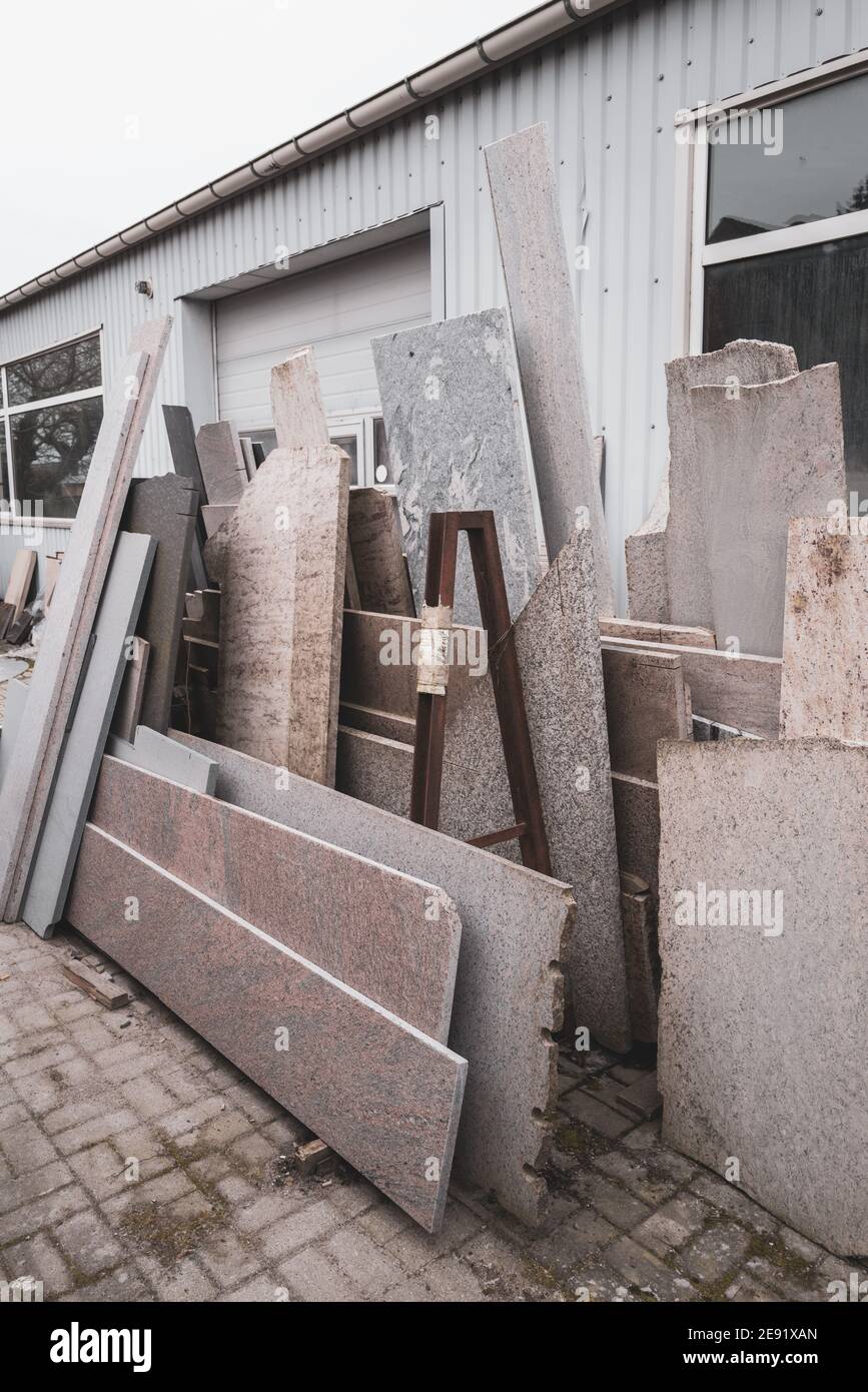 in the courtyard of a stonemason's workshop there are many different ...