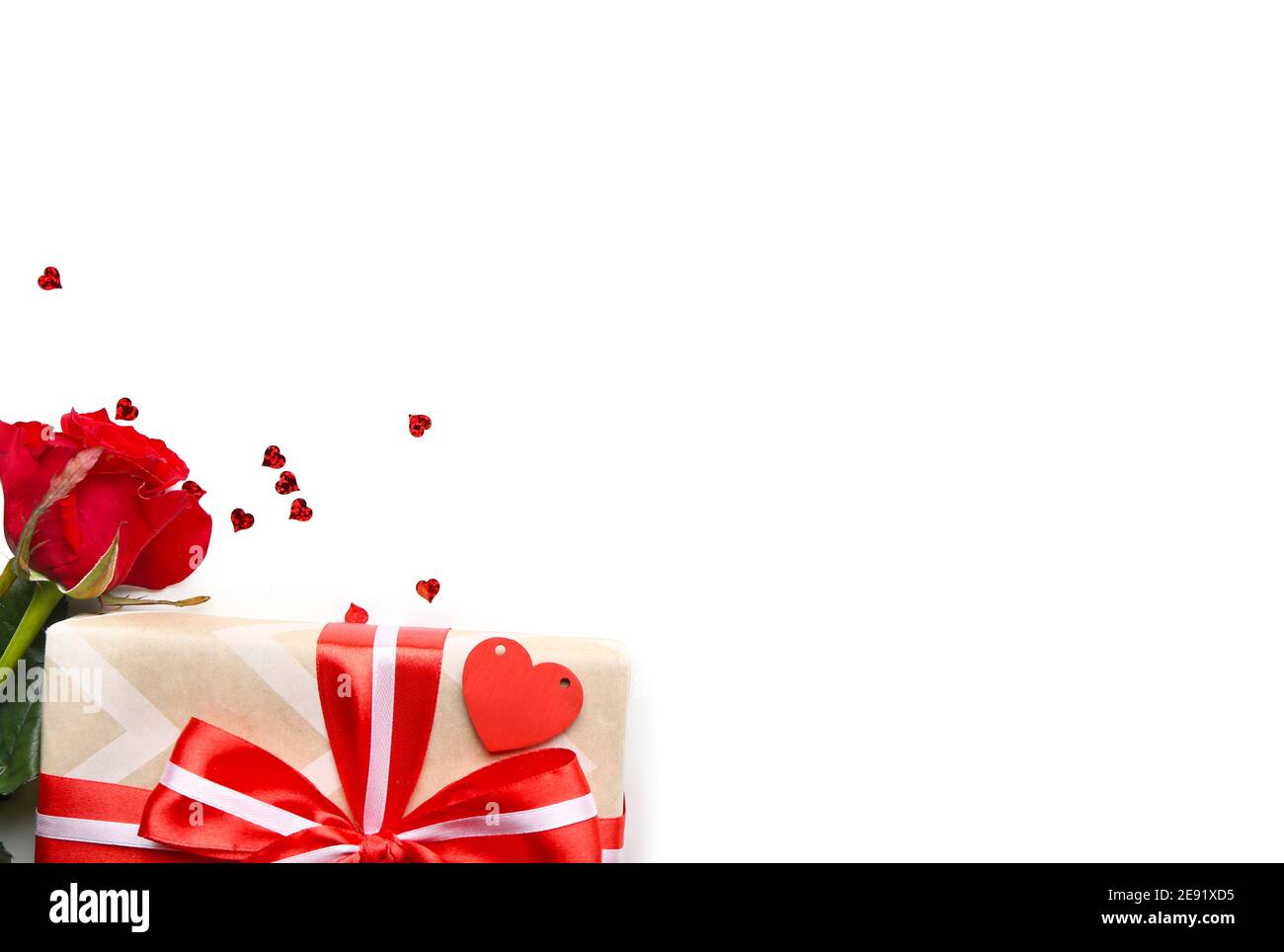 Beautiful gift with rose flower on white background Stock Photo - Alamy
