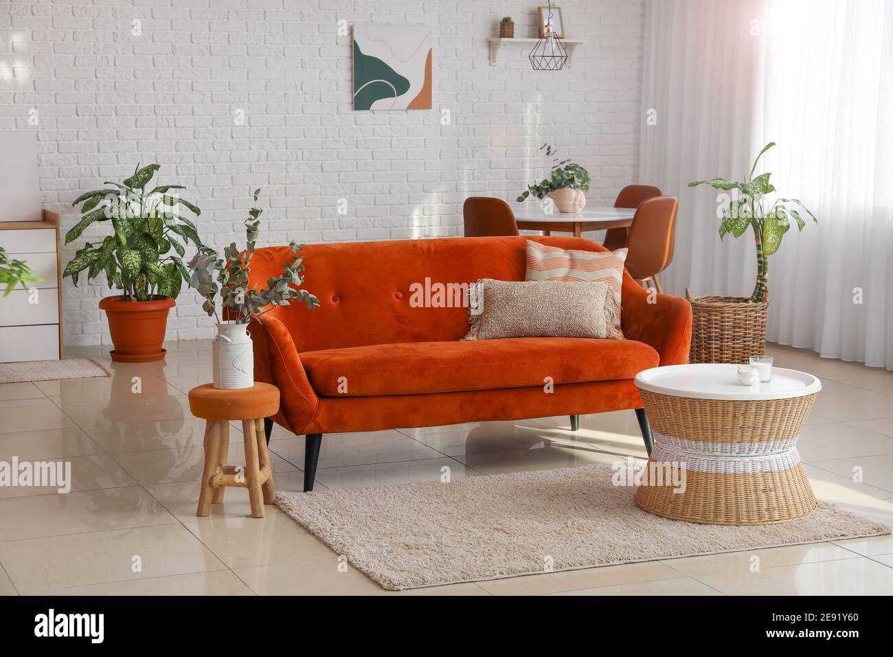 Interior of living room with sofa and dining table Stock Photo - Alamy
