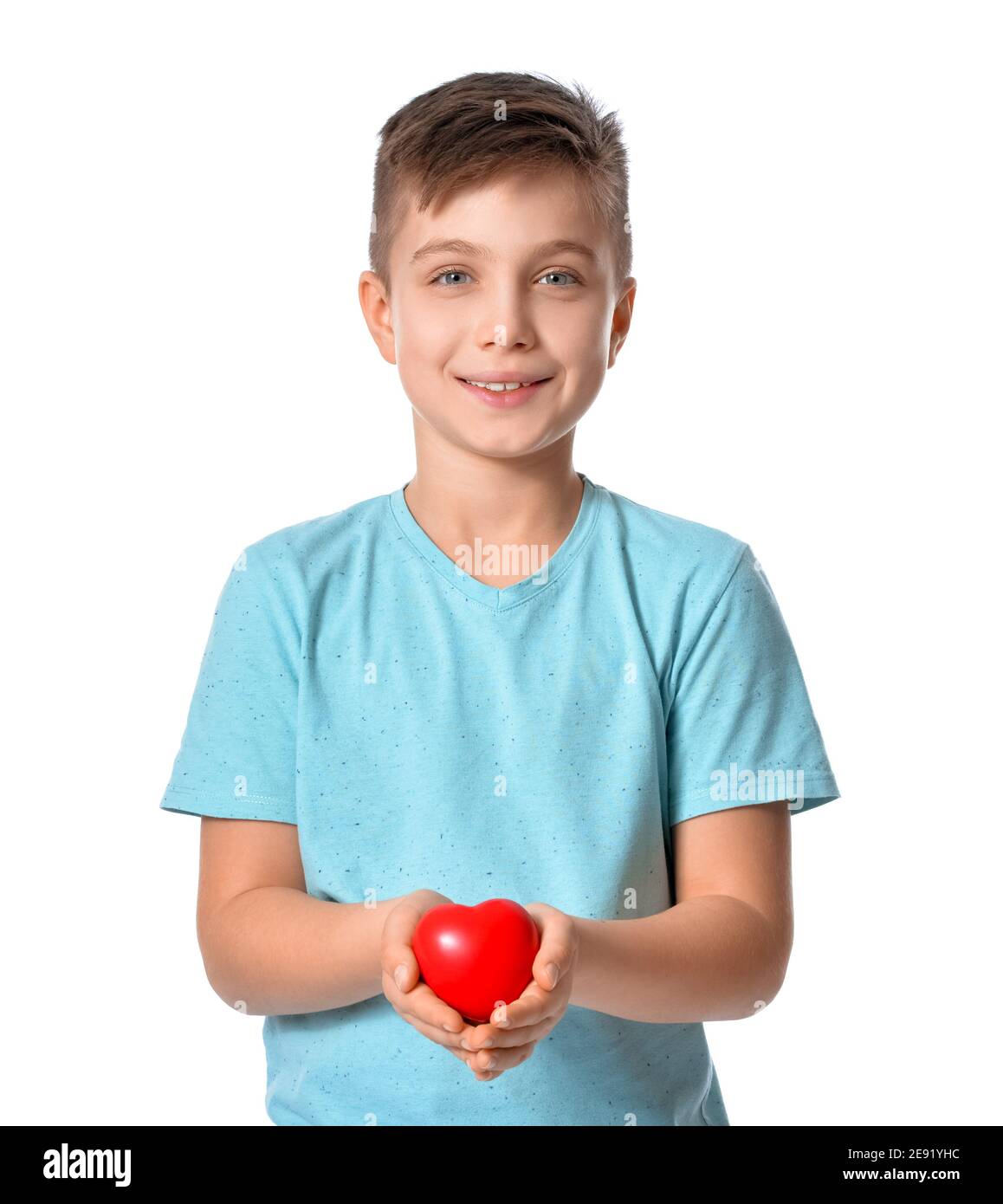 Cute little boy with red heart on white background Stock Photo - Alamy