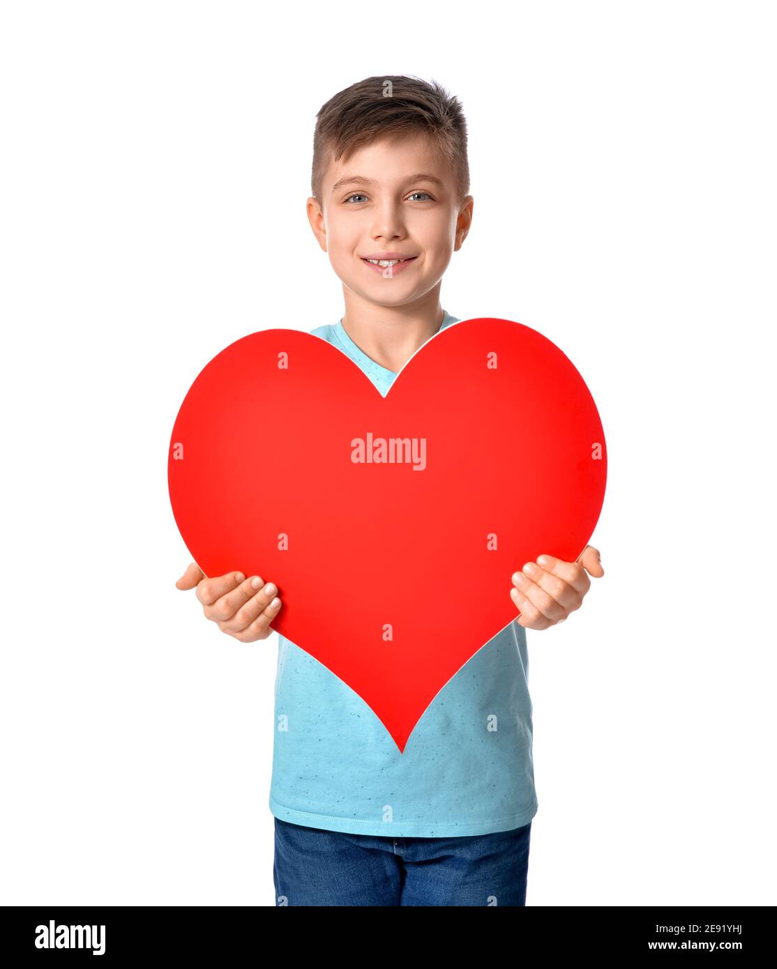 Cute little boy with red heart on white background Stock Photo - Alamy