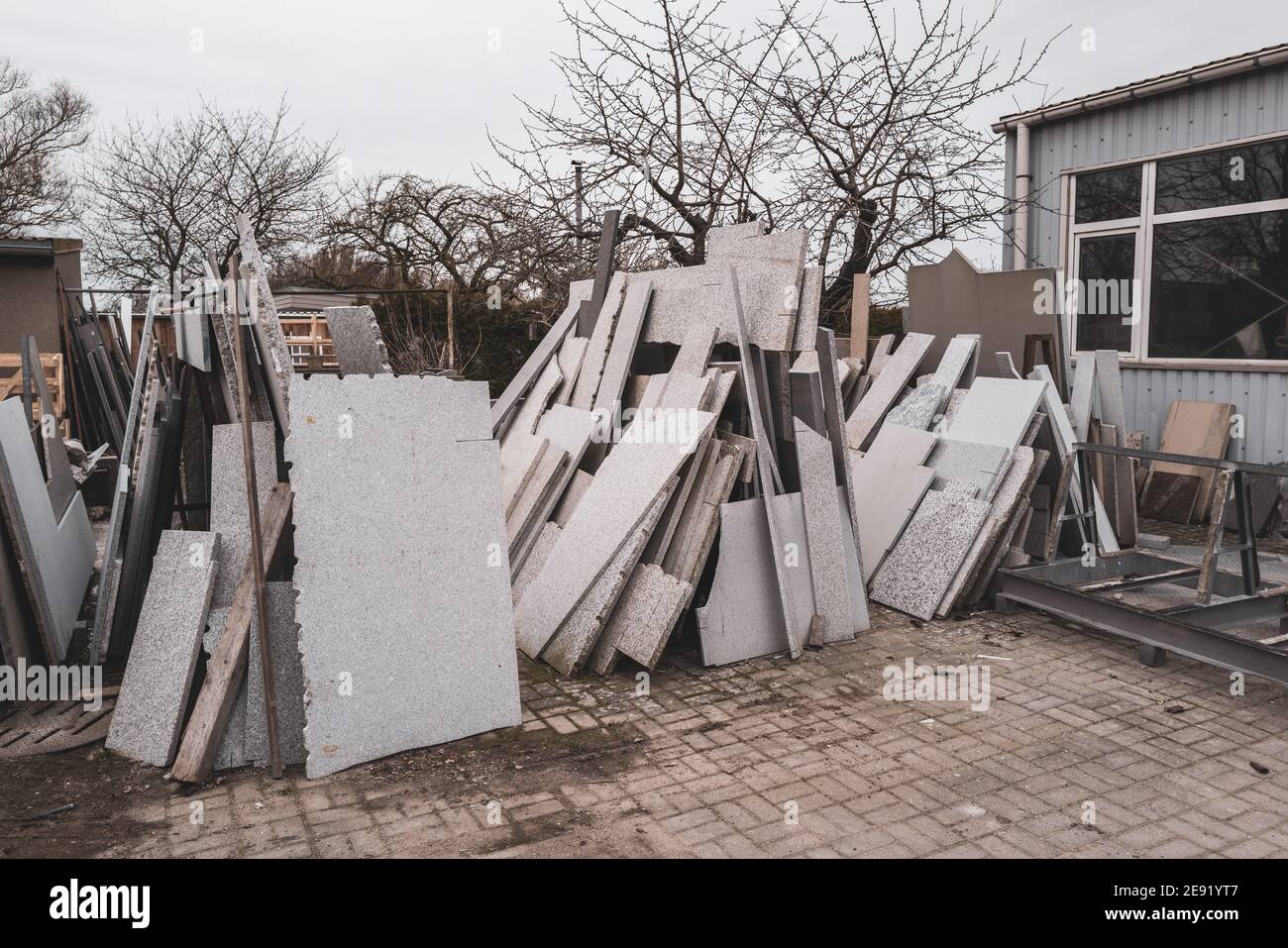 in the courtyard of a stonemason's workshop there are many different ...