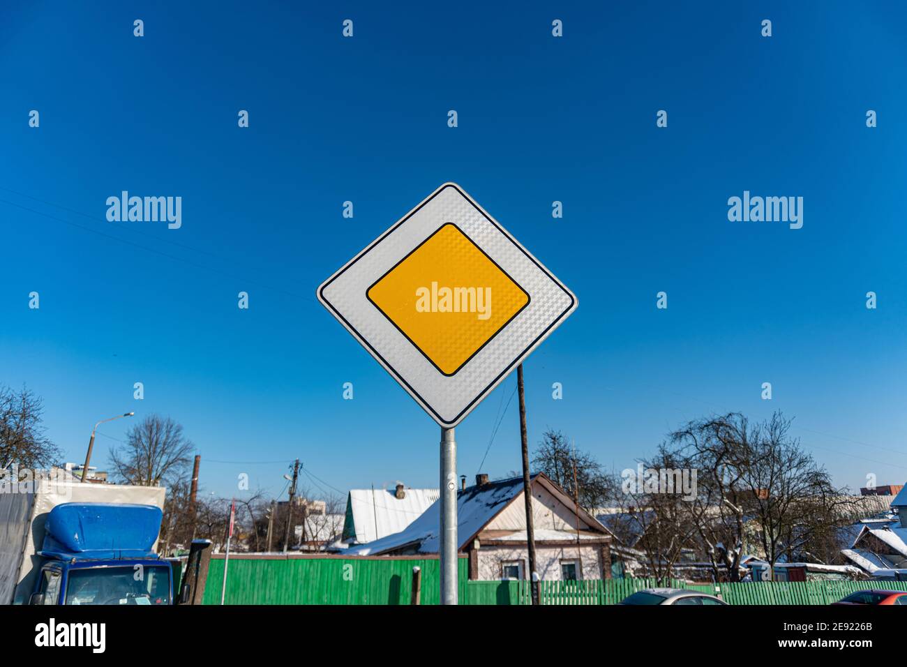 European priority road sign, sign main road on blue sky background ...