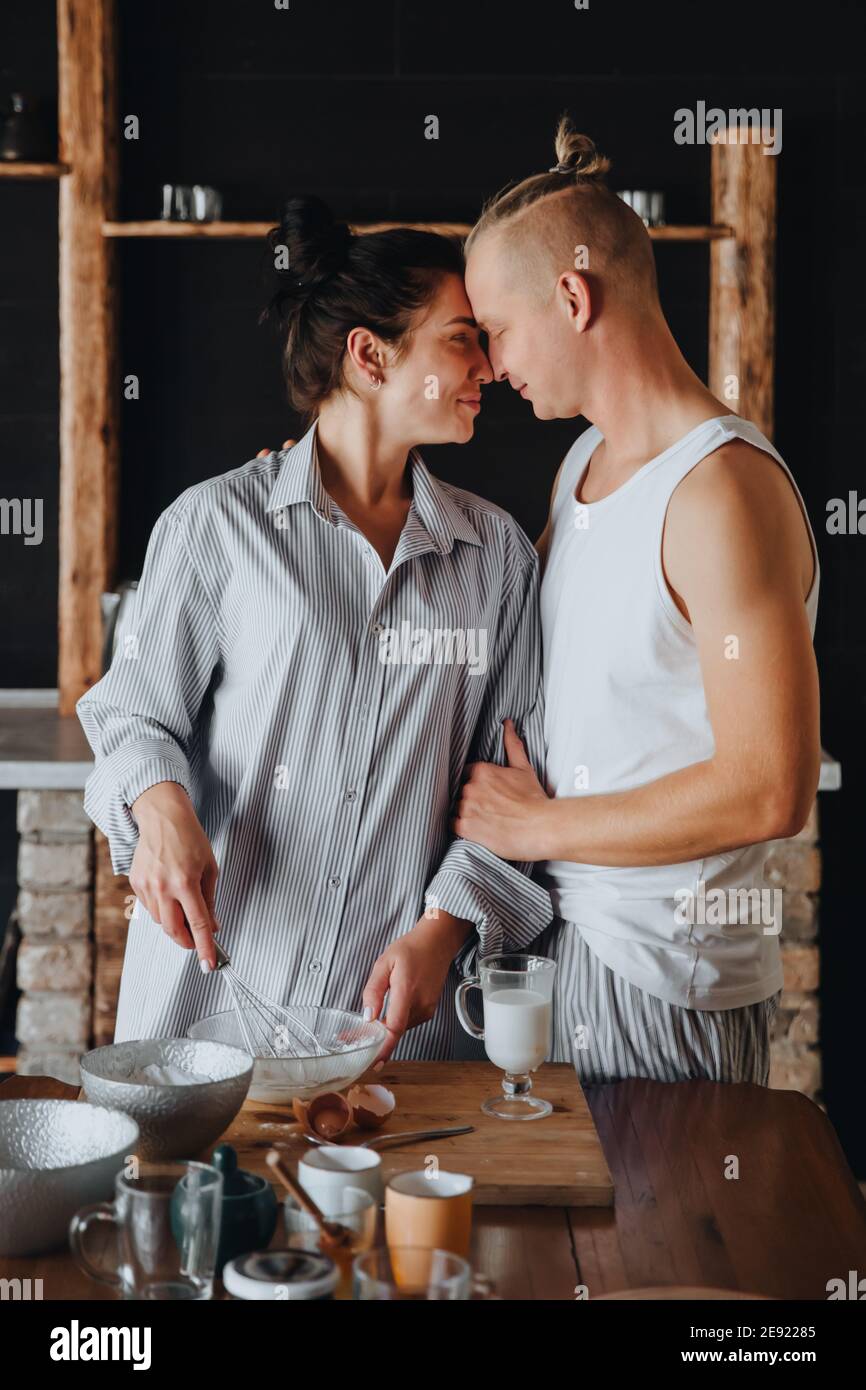 Young couple in love cook healthy food in the kitchen together. While ...