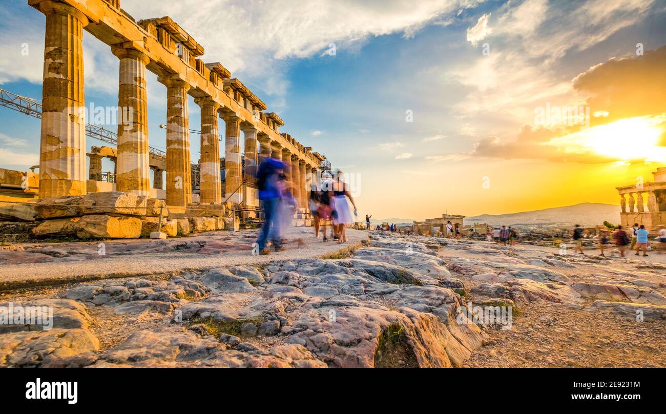 People in motion blur walking around the ruins of Parthenon temple in Athens, Greece Stock Photo ...