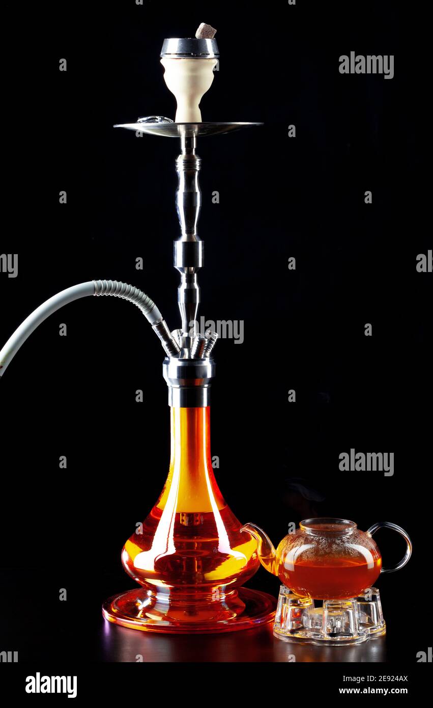 Modern shisha and glass teapot on black background Stock Photo - Alamy
