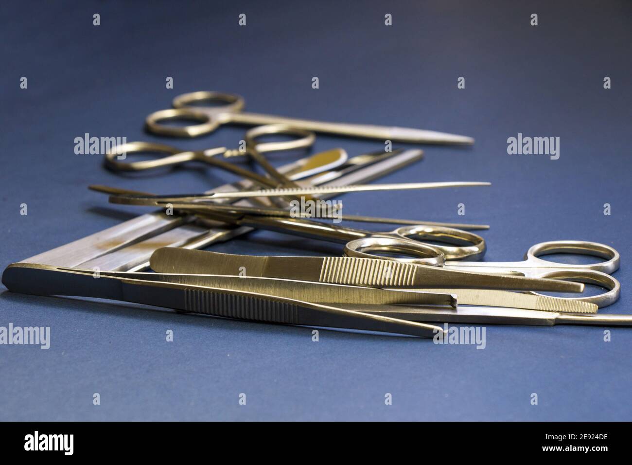 Set of stainless dissecting kits against blue background Stock Photo ...