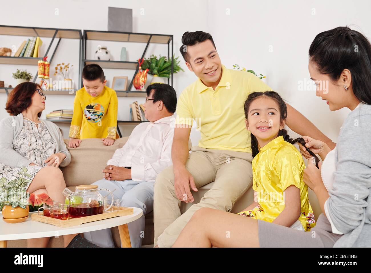 Family gathering at home Stock Photo - Alamy
