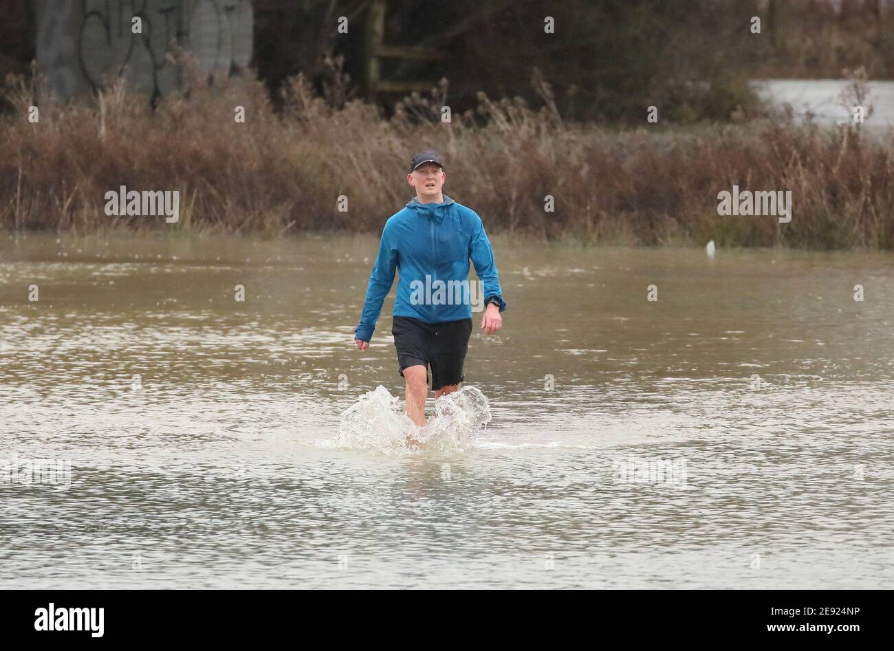 Runner in floodwater hi-res stock photography and images - Alamy