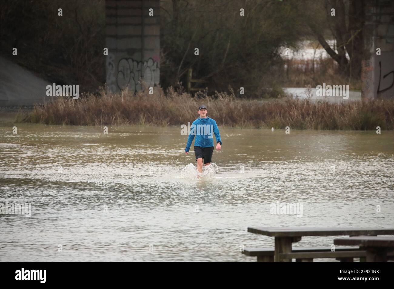 Runner in floodwater hi-res stock photography and images - Alamy