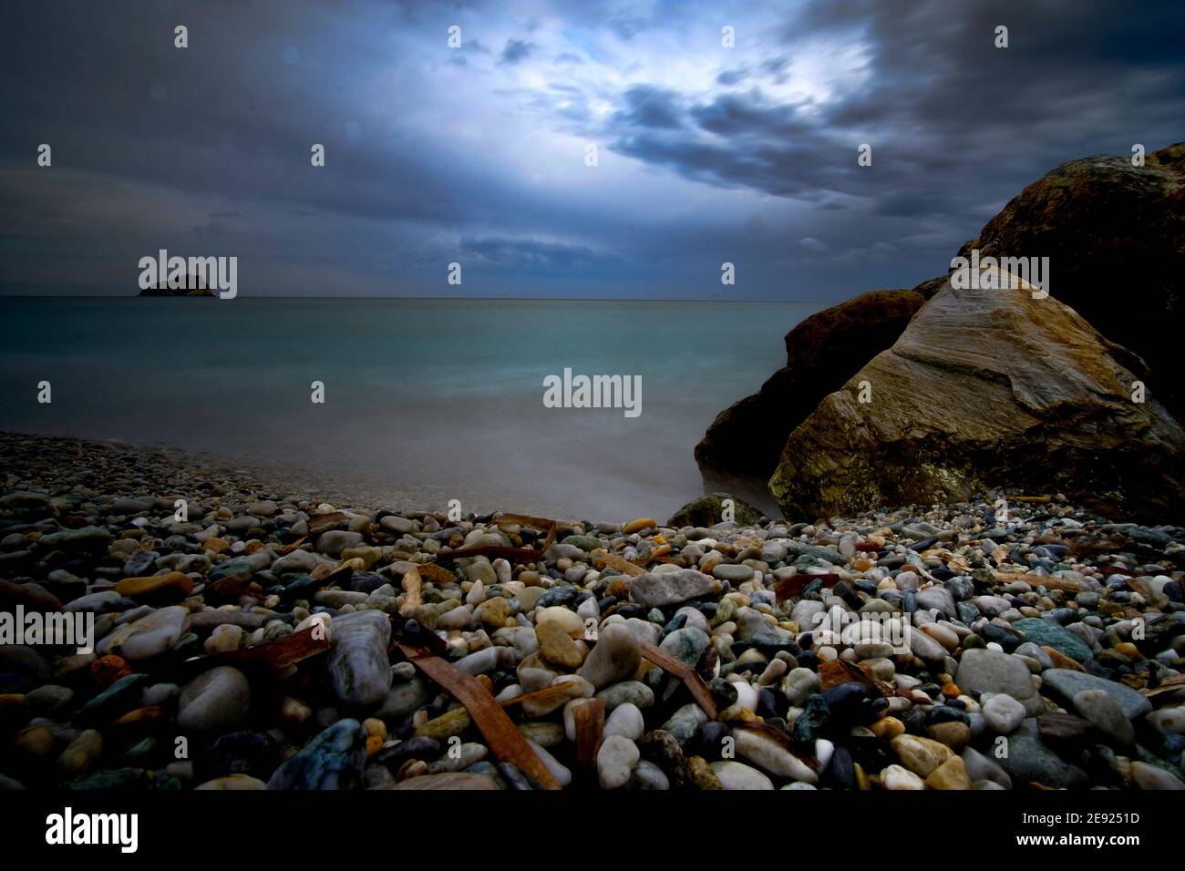 beautiful sandy and pebble beaches and an island in the background. sea ...
