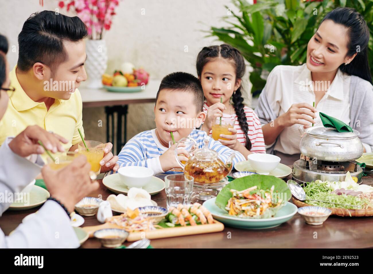 Family enjoying dinner Stock Photo - Alamy