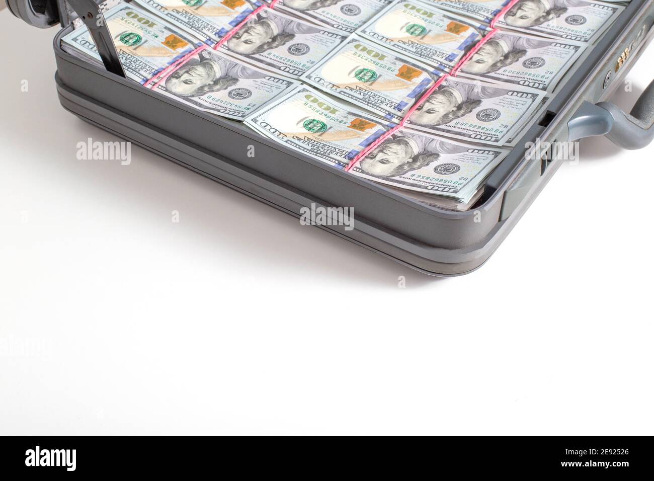 Case with money bills of 100 dollars on a white background. Wealth ...