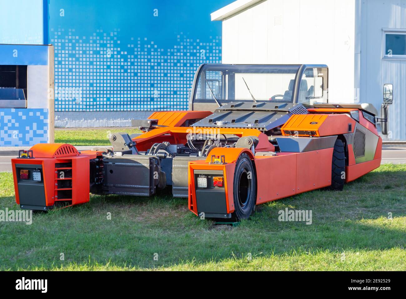 Aerodrome tow tractorstanding on the grass at the airport Stock Photo ...