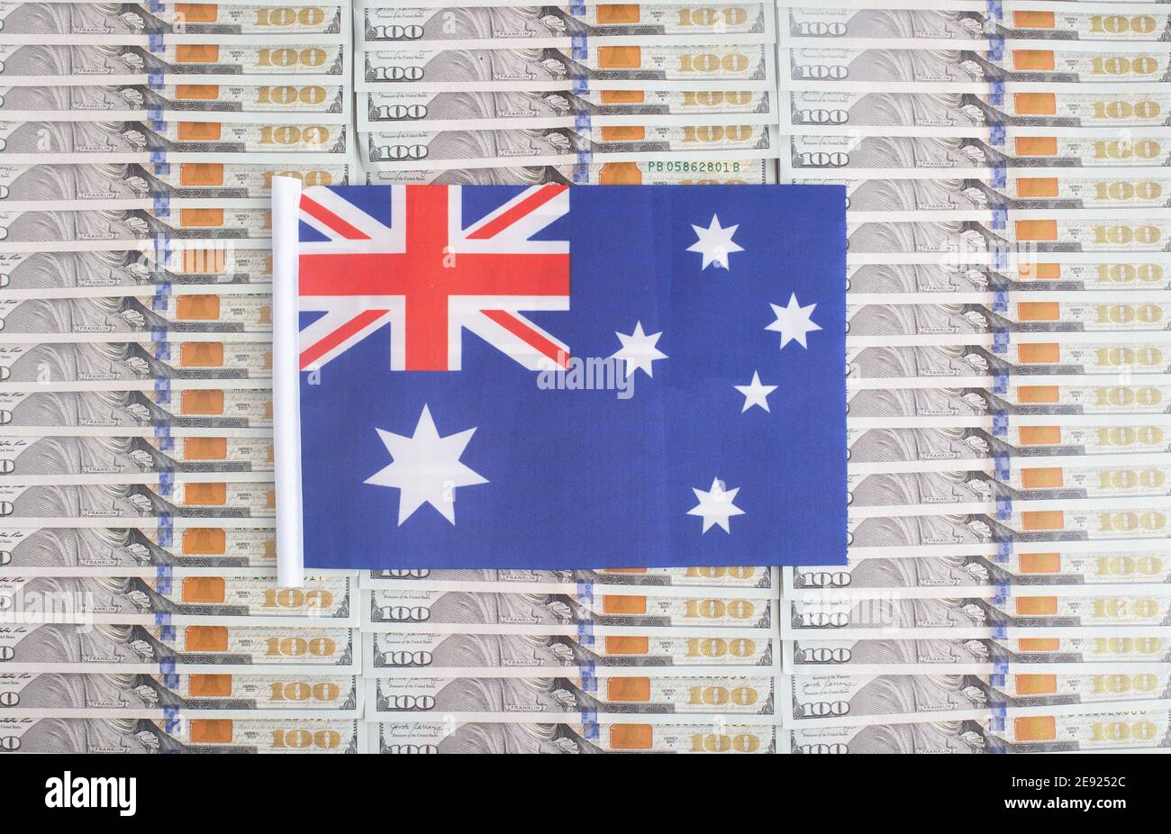 Australia flag on a background from dollar banknotes. Concept of the ...