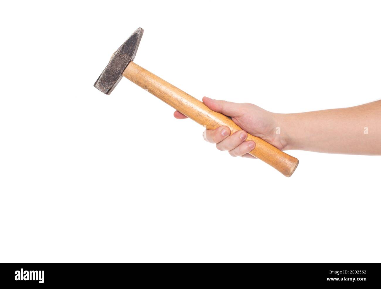 Man holds a hammer in his hand on a white background, isolate. Close-up ...