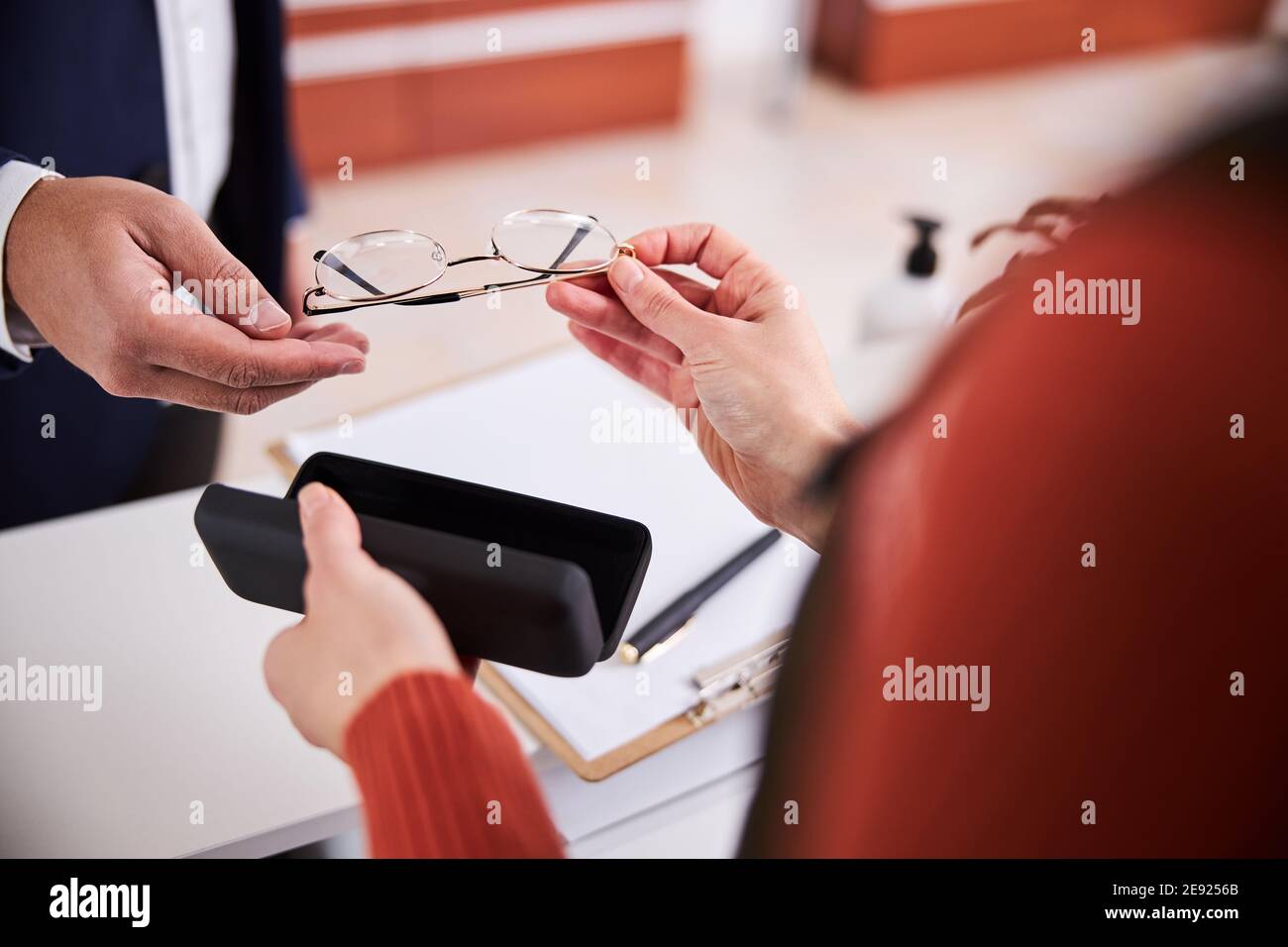 Male customer buying prescription glasses in an optical store Stock ...