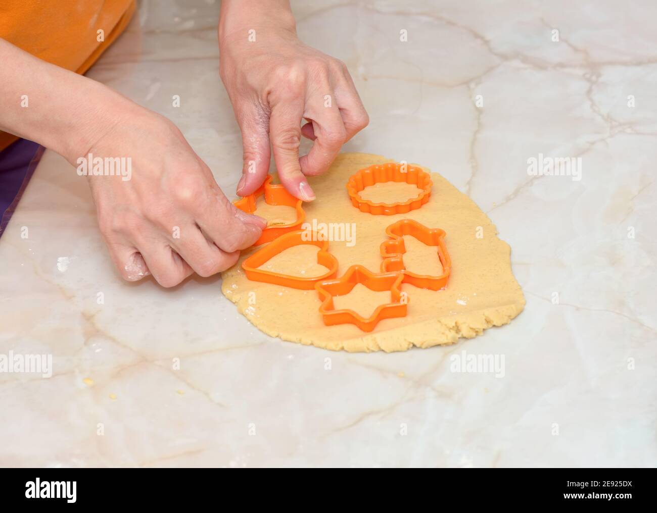 Woman making cookies cutter hi-res stock photography and images - Alamy