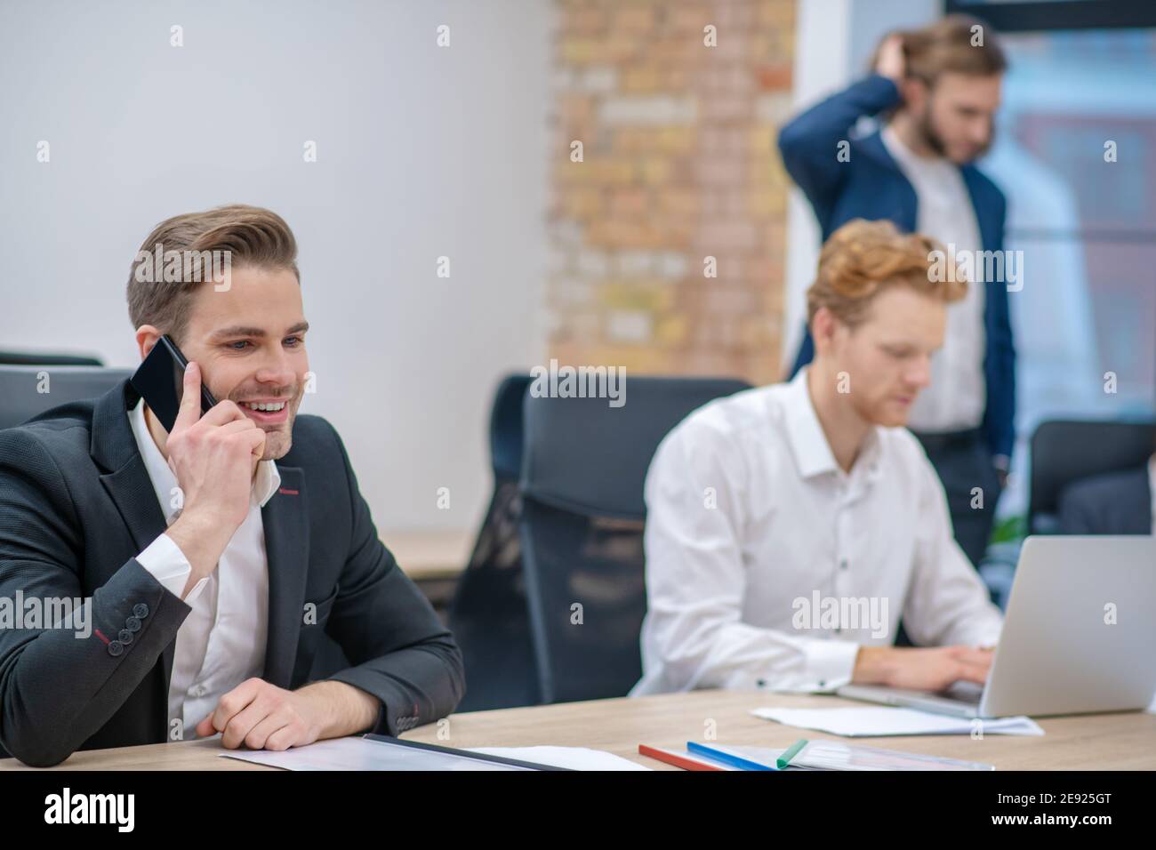 Focused on work man talking hi-res stock photography and images - Alamy