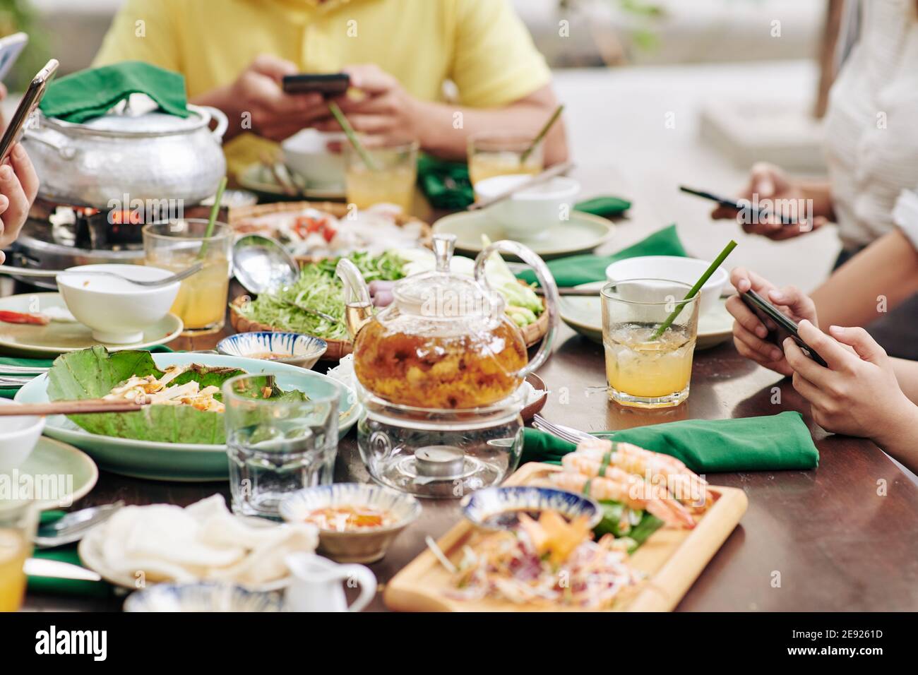 Texting at dinner table hi-res stock photography and images - Alamy