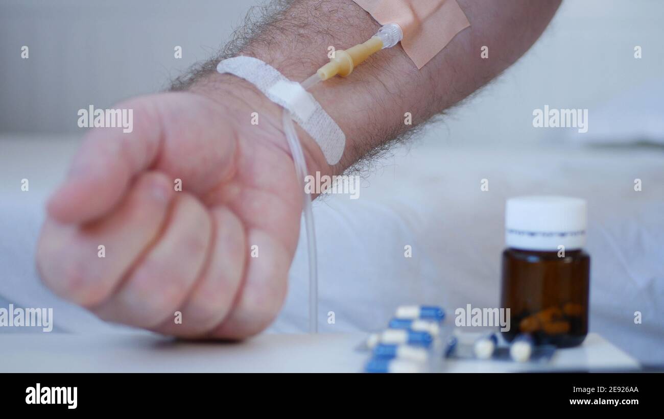 Sick Elderly Person in Hospital with Perfusion in Hand and Medical ...